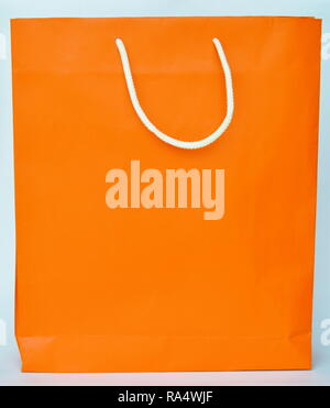 orange paper bag with white nylon handle Stock Photo - Alamy