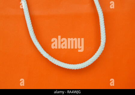 orange paper bag with white nylon handle Stock Photo - Alamy