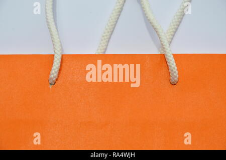 orange paper bag with white nylon handle Stock Photo - Alamy