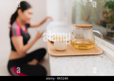 Home yoga setup with tea. Zen accessories for meditation and relaxation ...