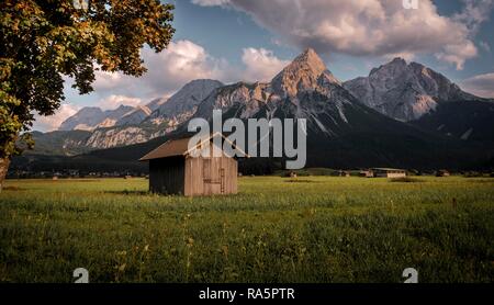 Haystack, hut in a meadow, Sonnenspitze at the back, mountain landscape ...