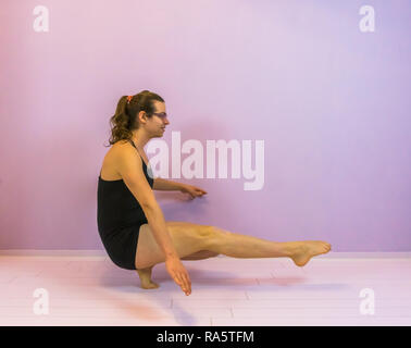 Young transgender ballet dancing girl posing on a chair, LGBT portrait ...