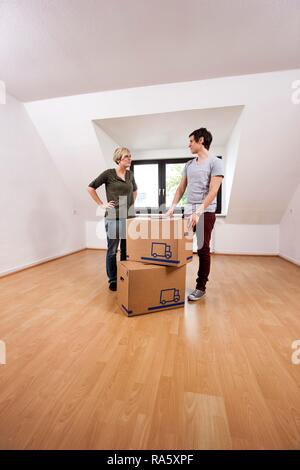Young pair moving in to new apartment under mortgage Stock Photo - Alamy