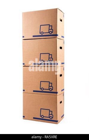 Stacked moving carton boxes over white background Stock Photo - Alamy