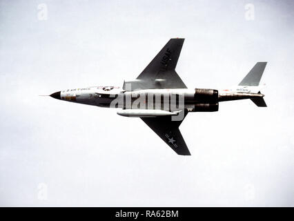 A air-to-air underside view of an F-101 Voodoo aircraft banking to the ...