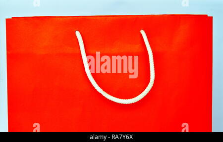 orange paper bag with white nylon handle Stock Photo - Alamy