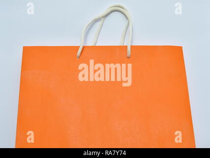 orange paper bag with white nylon handle Stock Photo - Alamy