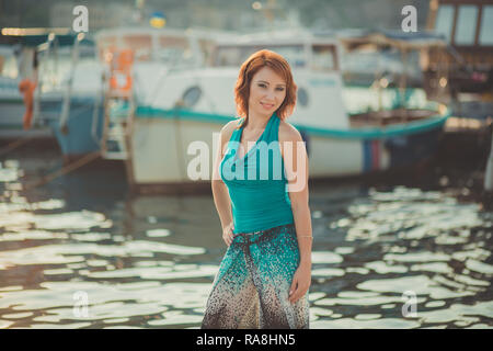 A girl with beautifull red hair on the yellow background. Stylish ...