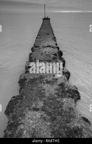 Sea defences and navigation markers at Elmer Sands beach near Middleton ...