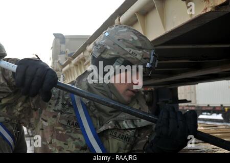 A U.S. Army M1078 Light Utility Truck performs an engine running ...