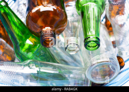 Glass bottles in blue waste basket Stock Photo - Alamy
