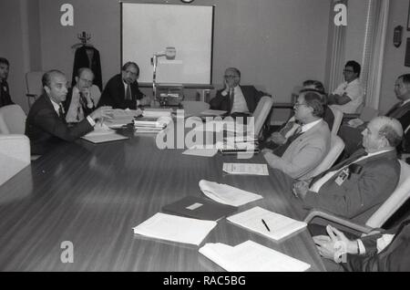 THESE GROUP OF MEN ARE HAVING A CONVERSATION AT A BUINESS MEETING Stock ...