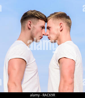 Handsome strong twins. Men strong muscular athlete bodybuilder posing ...