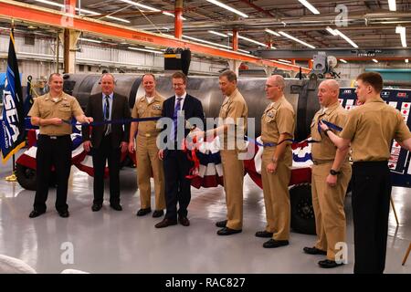 U.S. Navy Rear Adm. Derek Trinque, commander Task Force 76/3, left, and ...