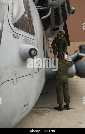 US Army mechanics service a CH-47 Chinook helicopter. Country: Unknown ...