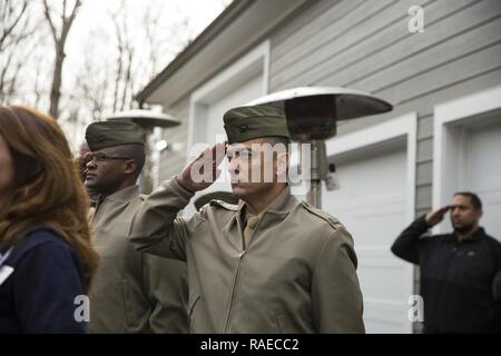 U.S. Marine Corps Col. Garrett Hoffman, center left, commanding officer ...