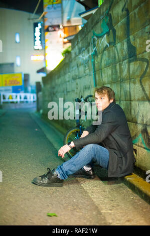 Caucasian male model poses for pictures on the street Stock Photo - Alamy