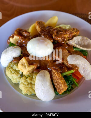 Closeup of gado-gado, Indonesian traditional salad dish wrapped in ...