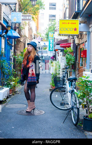 Asian female model poses for pictures in the street Stock Photo - Alamy