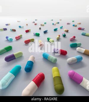Medical capsules and colour coding, illustration. The colouring of ...
