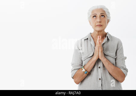 Grandmother praying. Old wrinkled beautiful woman praying with rosary ...