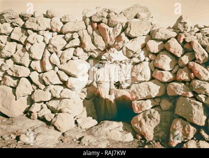 Sheep fold cave. Entrance, with shepherd. 1934, Middle East Stock Photo ...