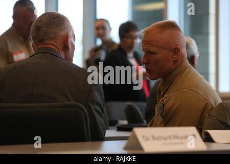 Brig. Gen. Thomas Weidley speaks with Richard Woodruff during the ...