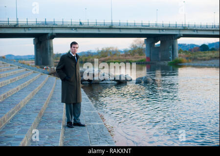 Caucasian male model poses for pictures on the street Stock Photo - Alamy