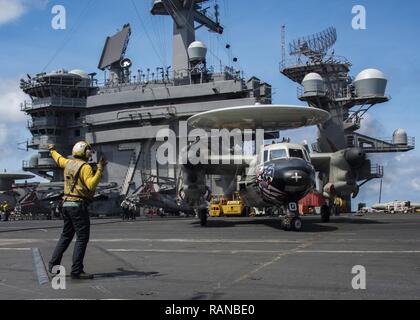 The crew of an E-2C Hawkeye depart the aircraft via the flight deck of ...