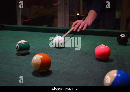 Game of pool, person playing pool and hitting balls Stock Photo - Alamy