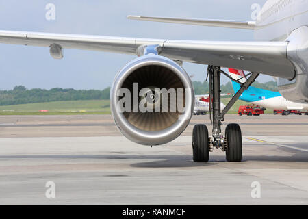 The airplane on the runway at the airport turbine of the aircraft plane ...