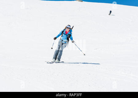 Female back-country skier tackling a steep slope Stock Photo - Alamy