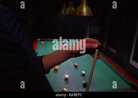 Game of pool, person playing pool and hitting balls Stock Photo - Alamy