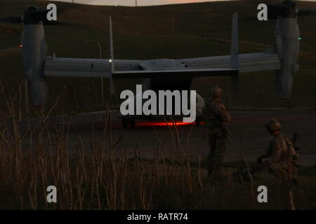 U.S. Air Force pararescue jumpers review their notes and plan of action ...