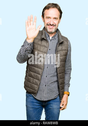 Hello winter. Portrait of smiling elegant woman in beige sweater ...