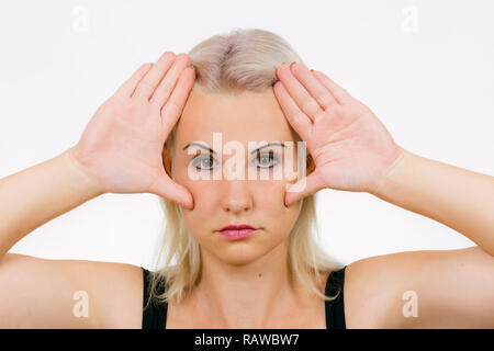 Face exercise cheekbone push up, female face with hands pulling the ...