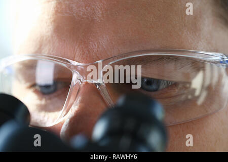 Scientist male researcher looking visual display overlay information ...