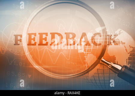 Magnifying glass showing feedback word Stock Photo - Alamy