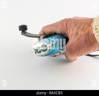 hand winding up a torch Stock Photo - Alamy