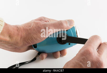 hand winding up a torch Stock Photo - Alamy