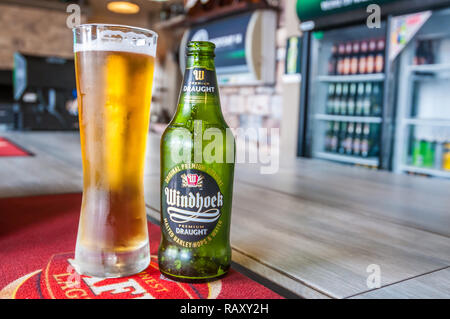 Namibia beer - Windhoek lager bottle and glass, in Namibia Africa Stock ...