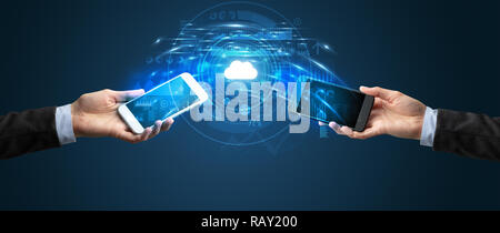 Two mobile phones syncing through the cloud Stock Photo - Alamy