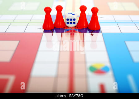 Picture of colorful ludo tokens on the ludo board game Stock Photo - Alamy