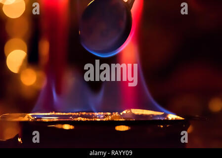 burnt punch: blue flame with colored fire background Stock Photo - Alamy
