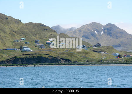 The city of Unalaska, also known as Dutch Harbor, surrounded by ...