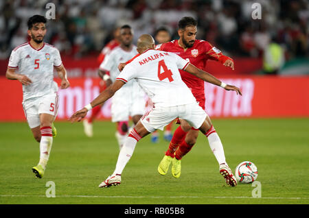 Ali Madan of Bahrain going past Amer Abdulrahman of United Arab ...