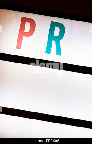 PR letters on backlight board. Colored Characters P and R on white ...