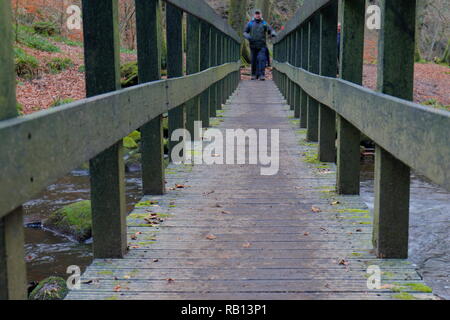 A footbridge across Hebden Beck at Hardcastle Crags in Hebden Bridge ...