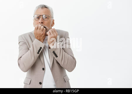 Anxious scared senior man biting fingernails Stock Photo - Alamy