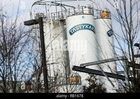 A logo sign outside of the headquarters of the Tasty Baking Company ...